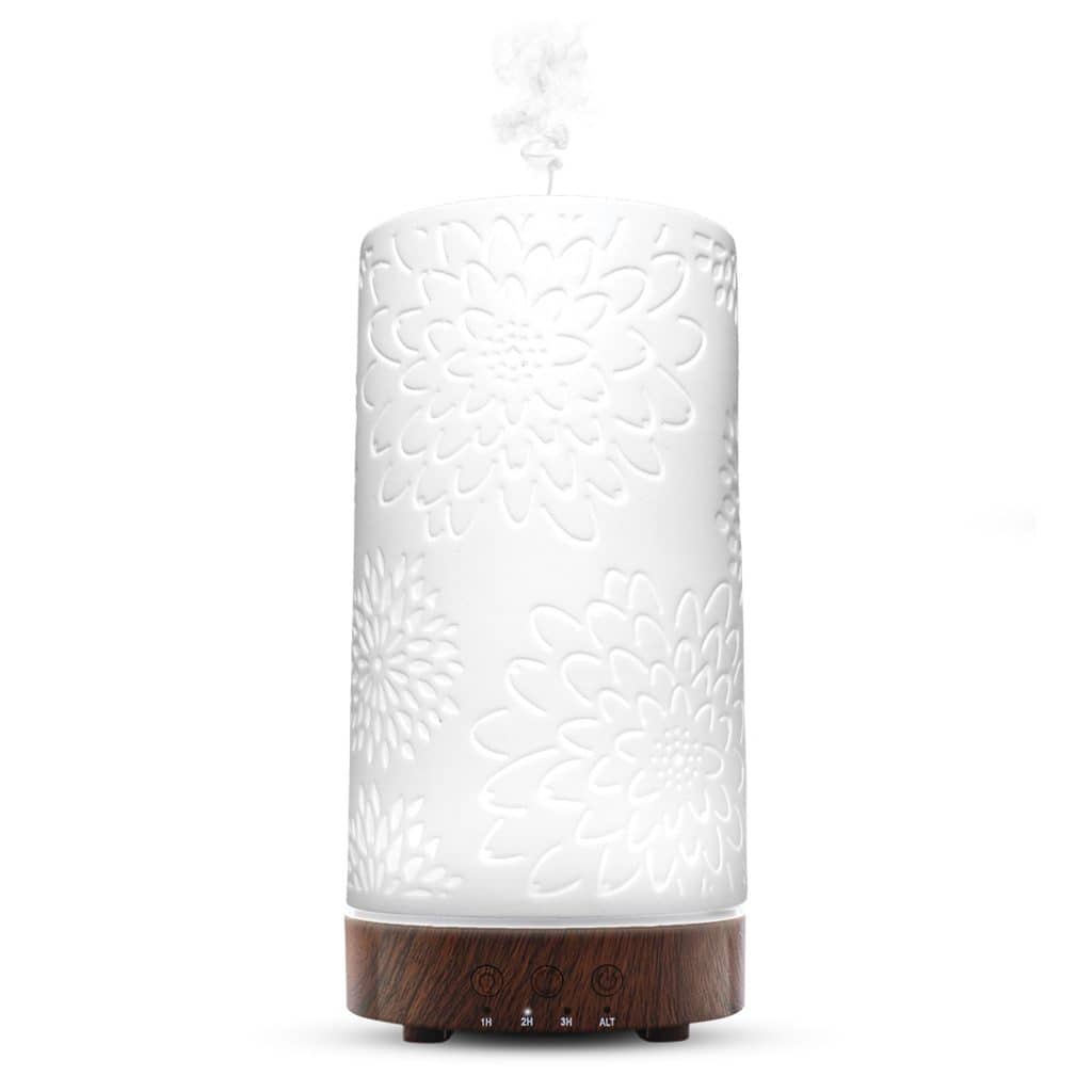 Joy hand crafted ceramic aroma diffuser with white floral cutouts ...