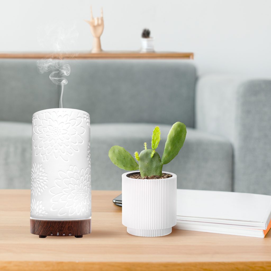 Joy hand crafted ceramic aroma diffuser with white floral cutouts ...